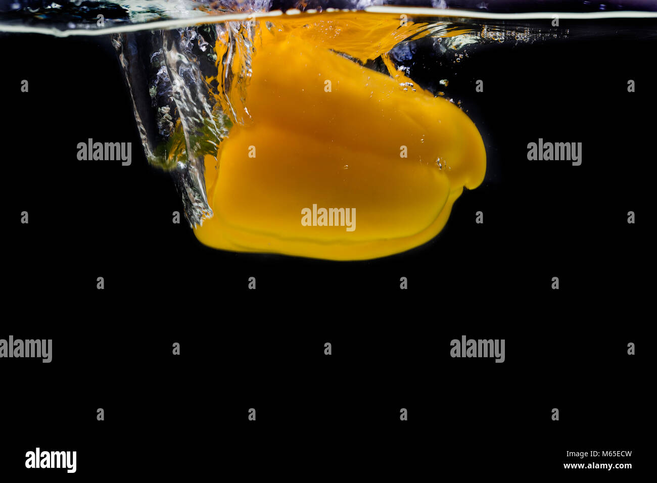 Yellow pepper , water splash Stock Photo - Alamy