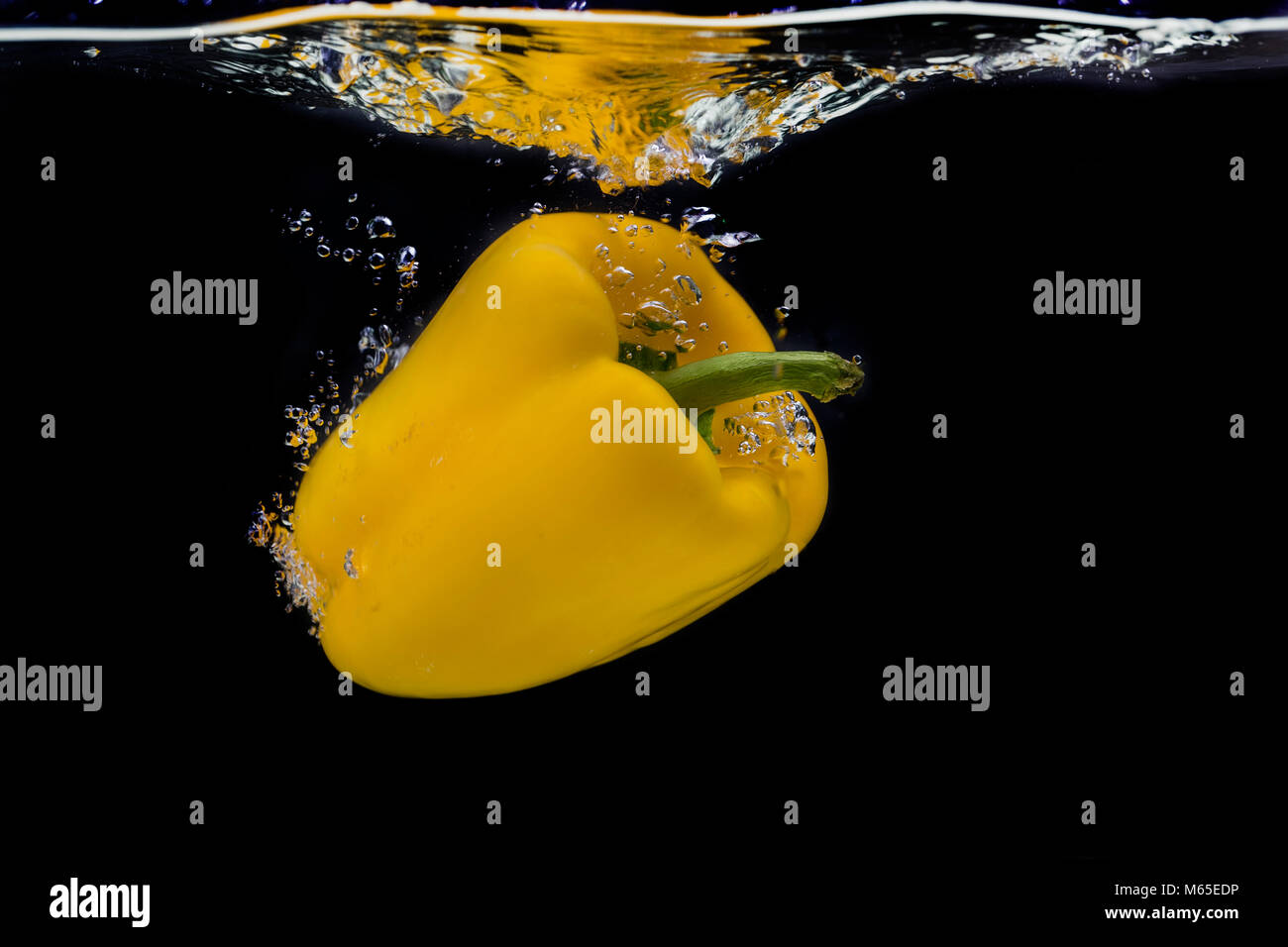 Yellow pepper , water splash Stock Photo - Alamy