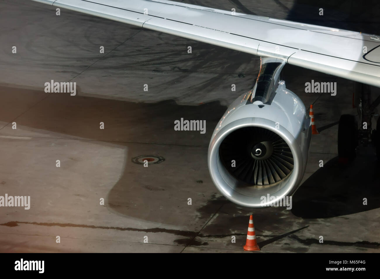 Aircraft wing, turbine and chassis closeup. Airplane loading at the ...