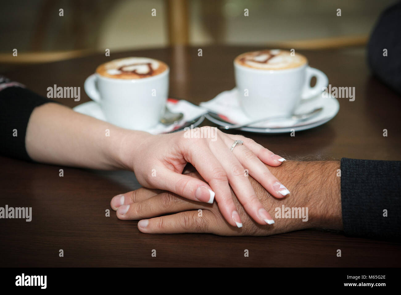 man and woman hands. love and cup coffee concept Stock Photo - Alamy