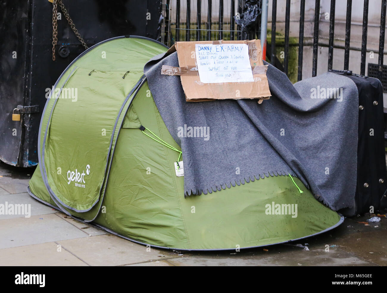 Homeless person sleeping outside Leicester Square underground station ... Homeless person sleeping outside Leicester Square underground station ...