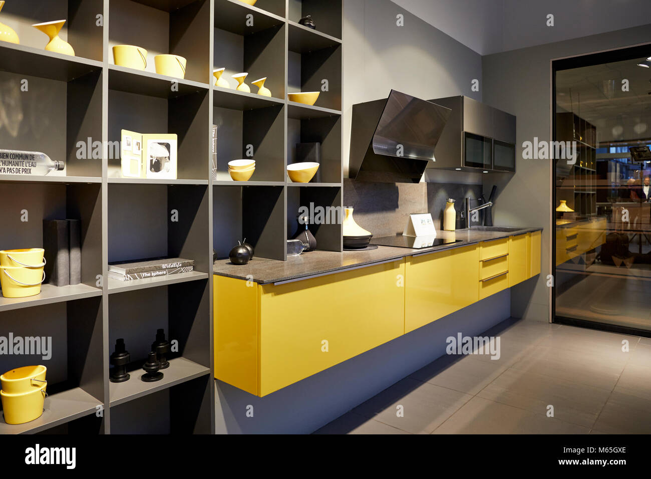 Modern yellow kitchen units with large shelfs Stock Photo - Alamy