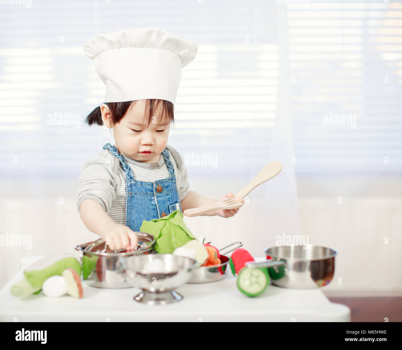 baby girl pretend play food toy Stock Photo - Alamy
