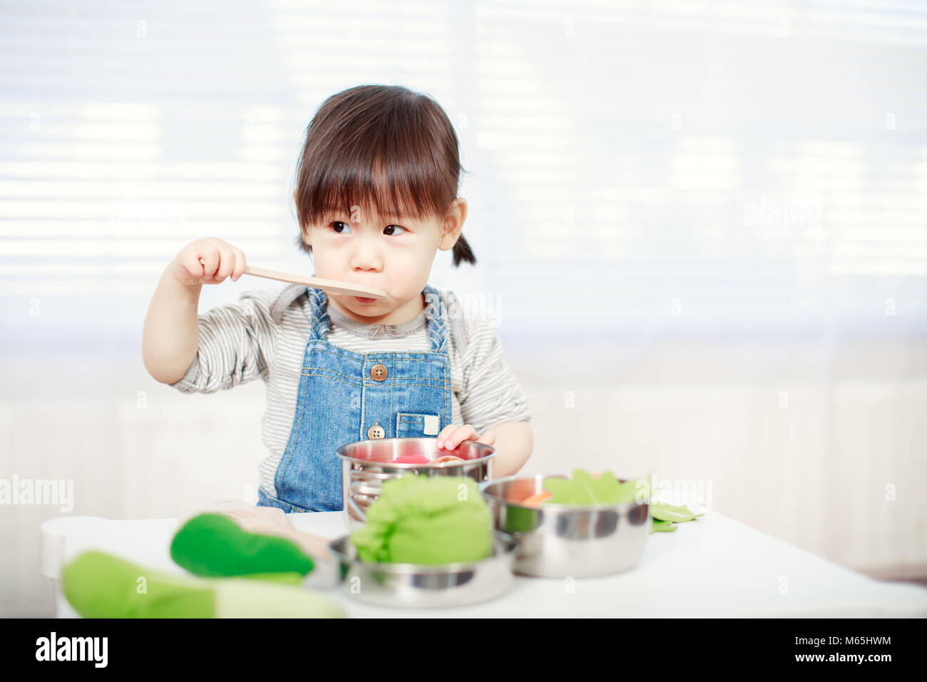 baby girl pretend play food toy Stock Photo - Alamy