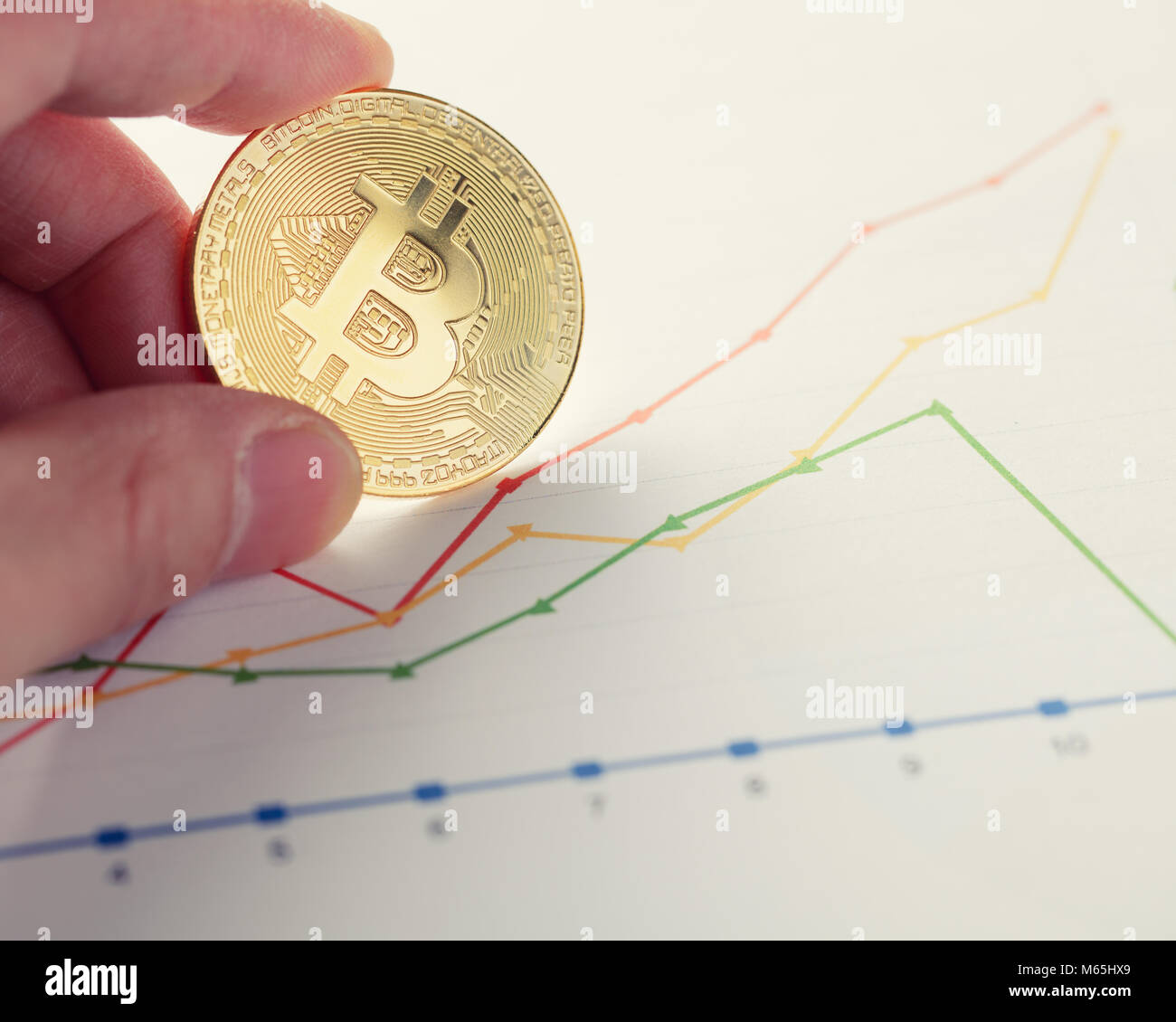 hand hold a bitcoin coin model Stock Photo - Alamy