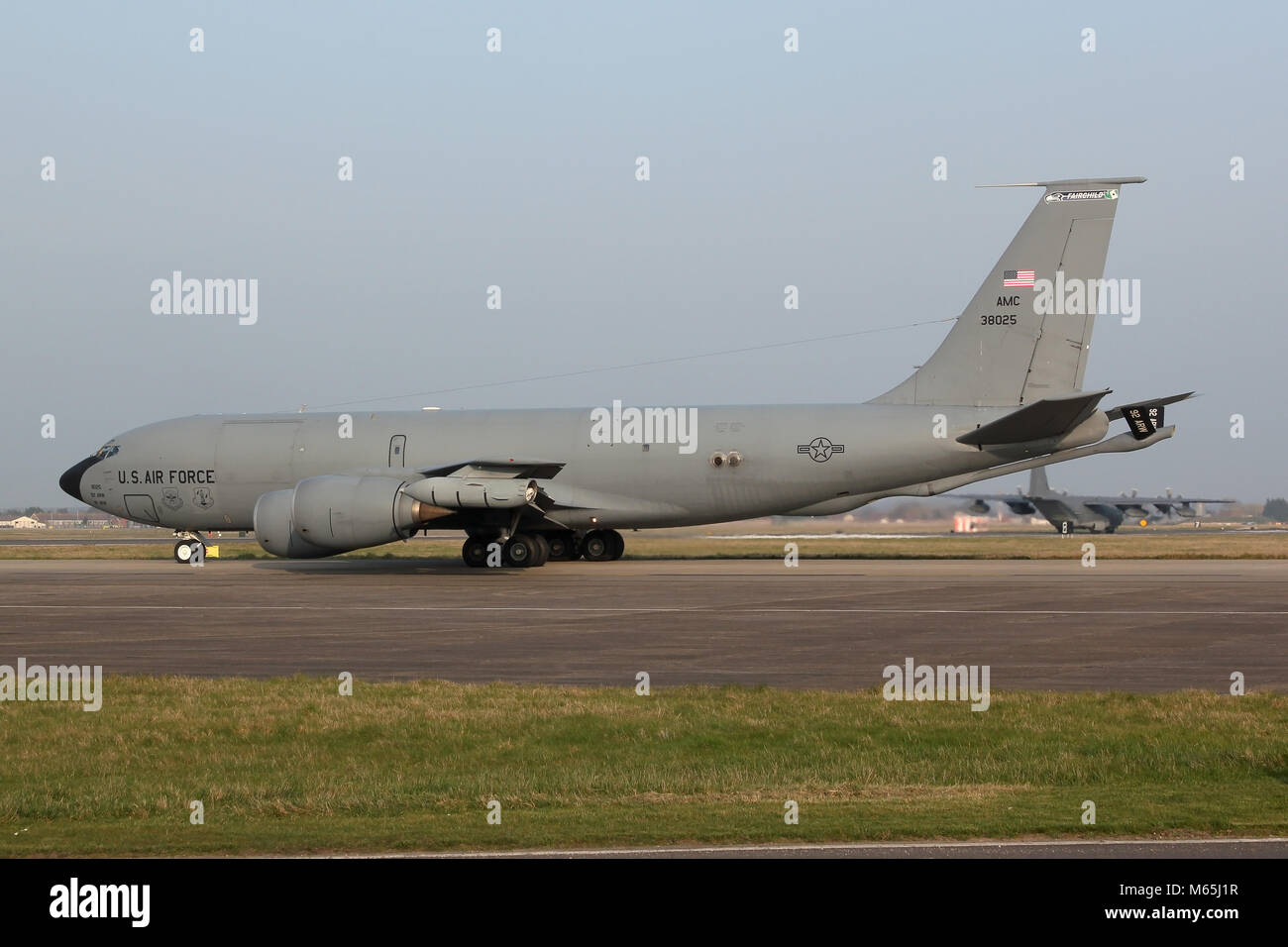 USAF KC-135R Stratotanker holding short of the runway at RAF Mildenhall whilst a based MC-130J ...