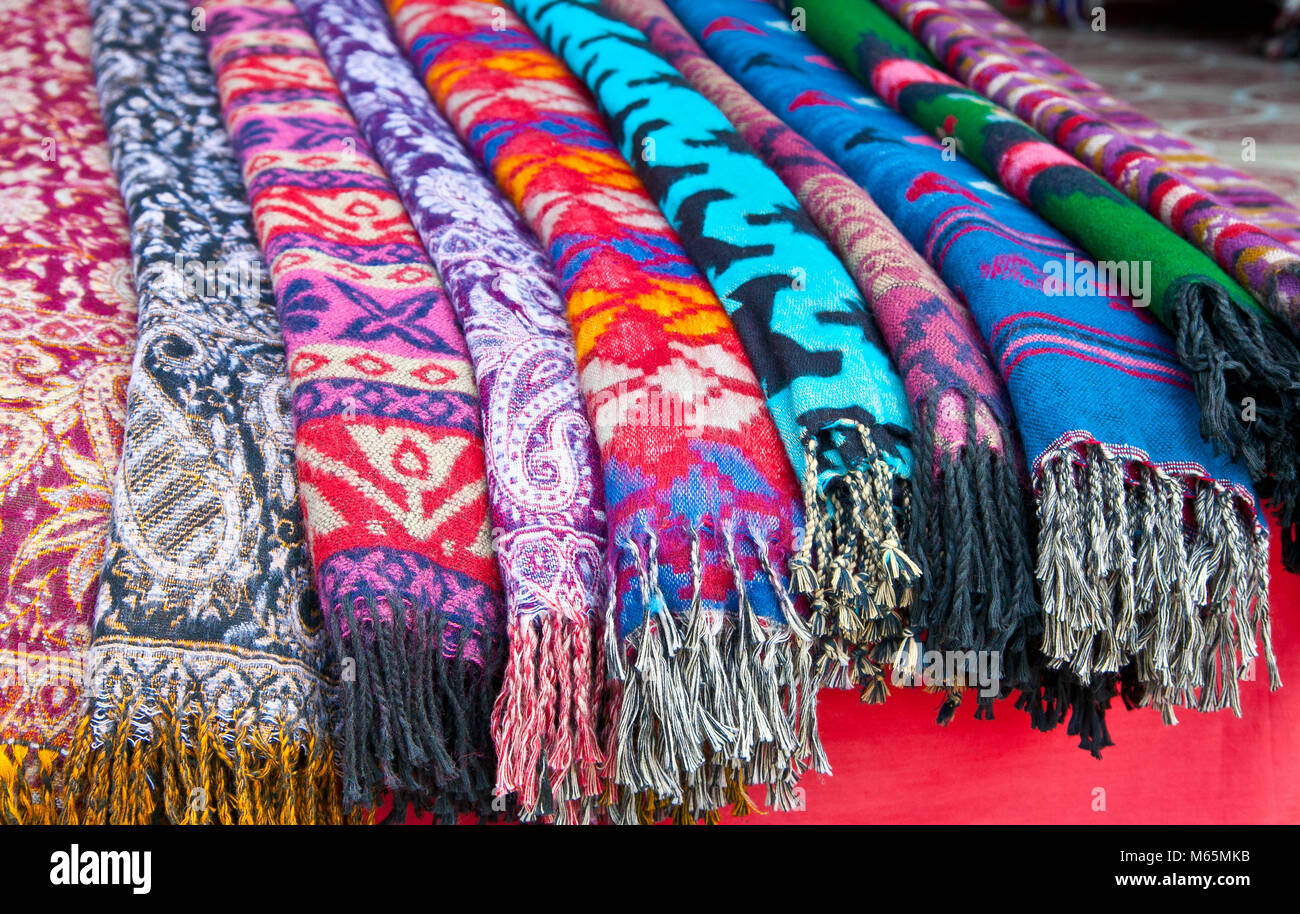 Pile of gentle folded shawls (scarfs) at the market, Pokhara, Nepal ...