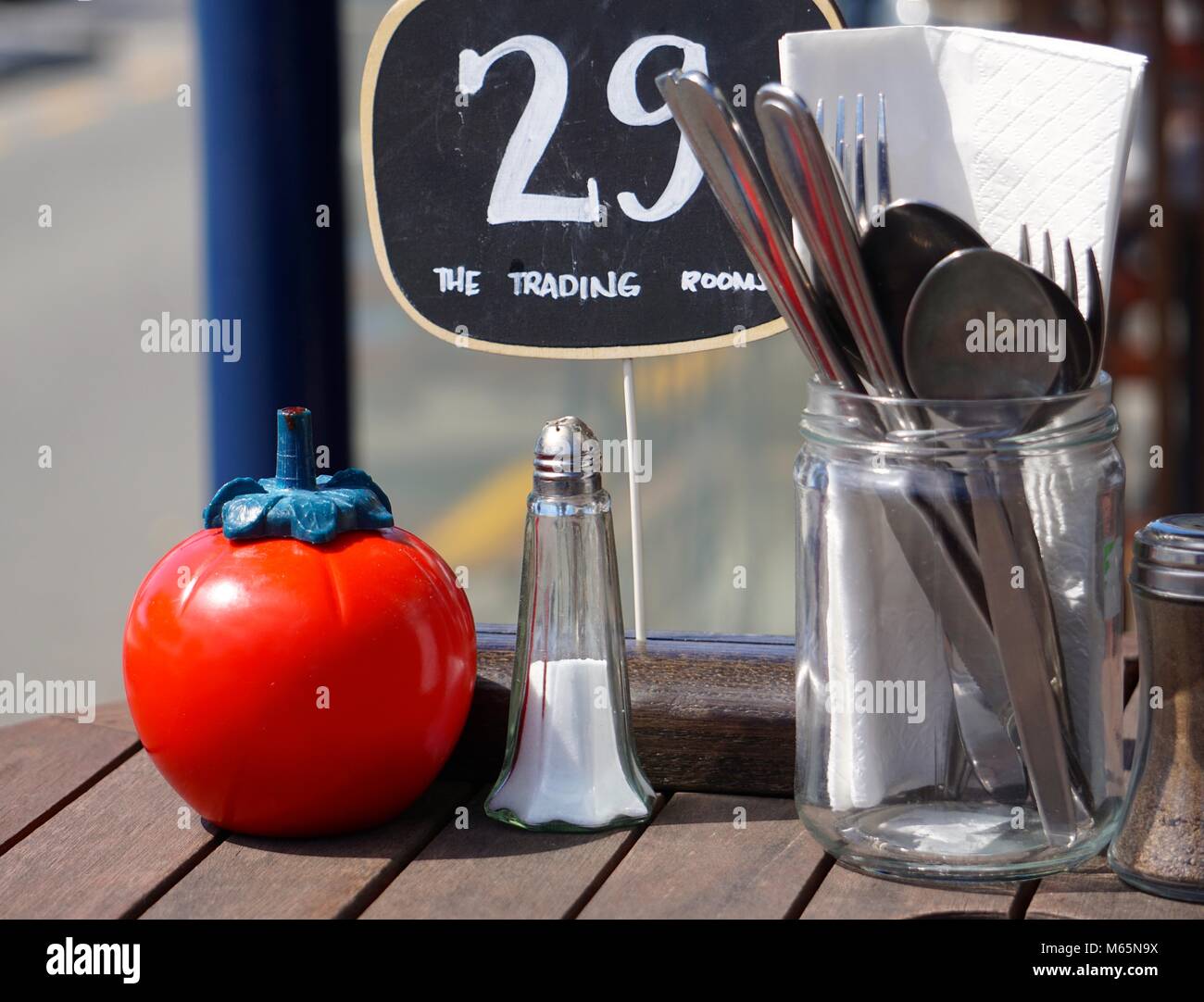 Outside Table setting ready for ordering Stock Photo - Alamy