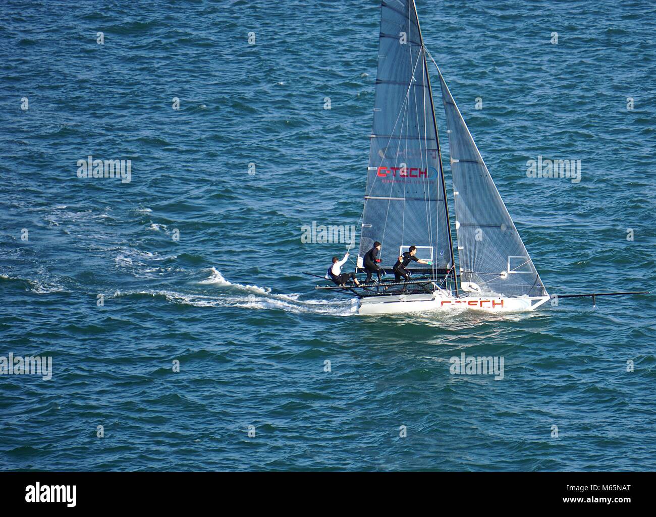 Sail boat navigating a race Stock Photo - Alamy