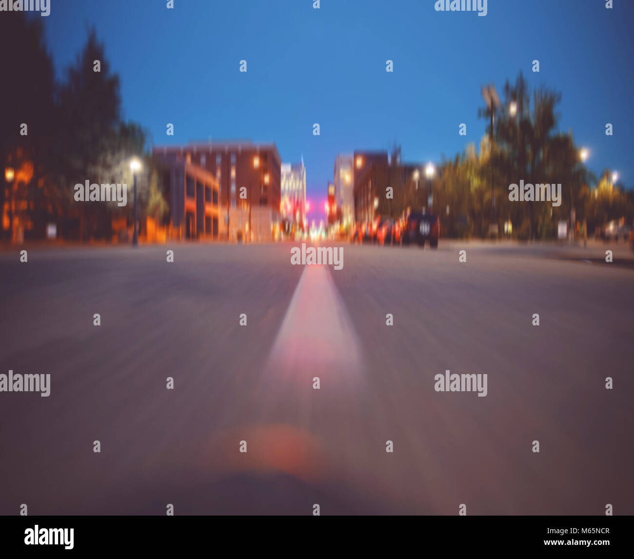 blurred motion photo of an empty street scene at night in an urban ...
