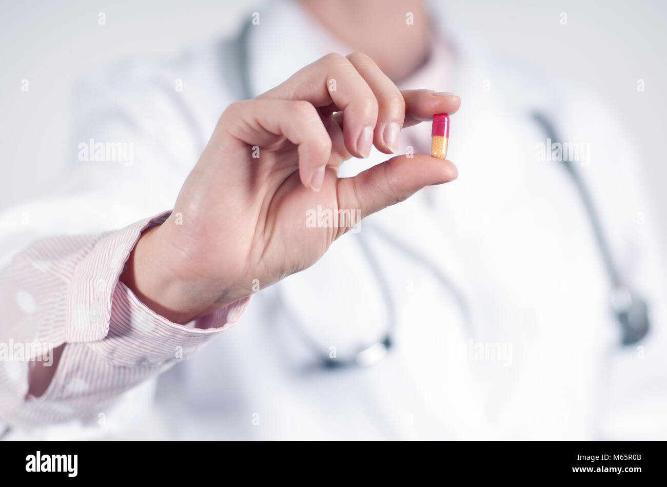 Pill in women's hands. Medicine tablet. Doctor giving showing medical ...