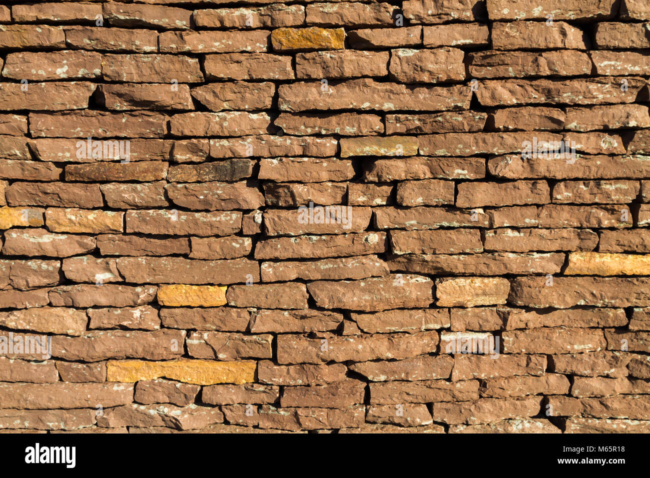 Brick wall made of stone tiles Stock Photo - Alamy