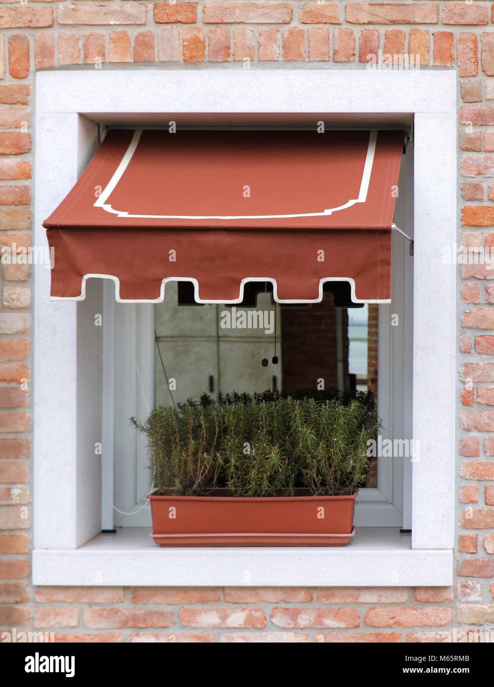 Retro window exterior with small canopy and flower pot Stock Photo - Alamy