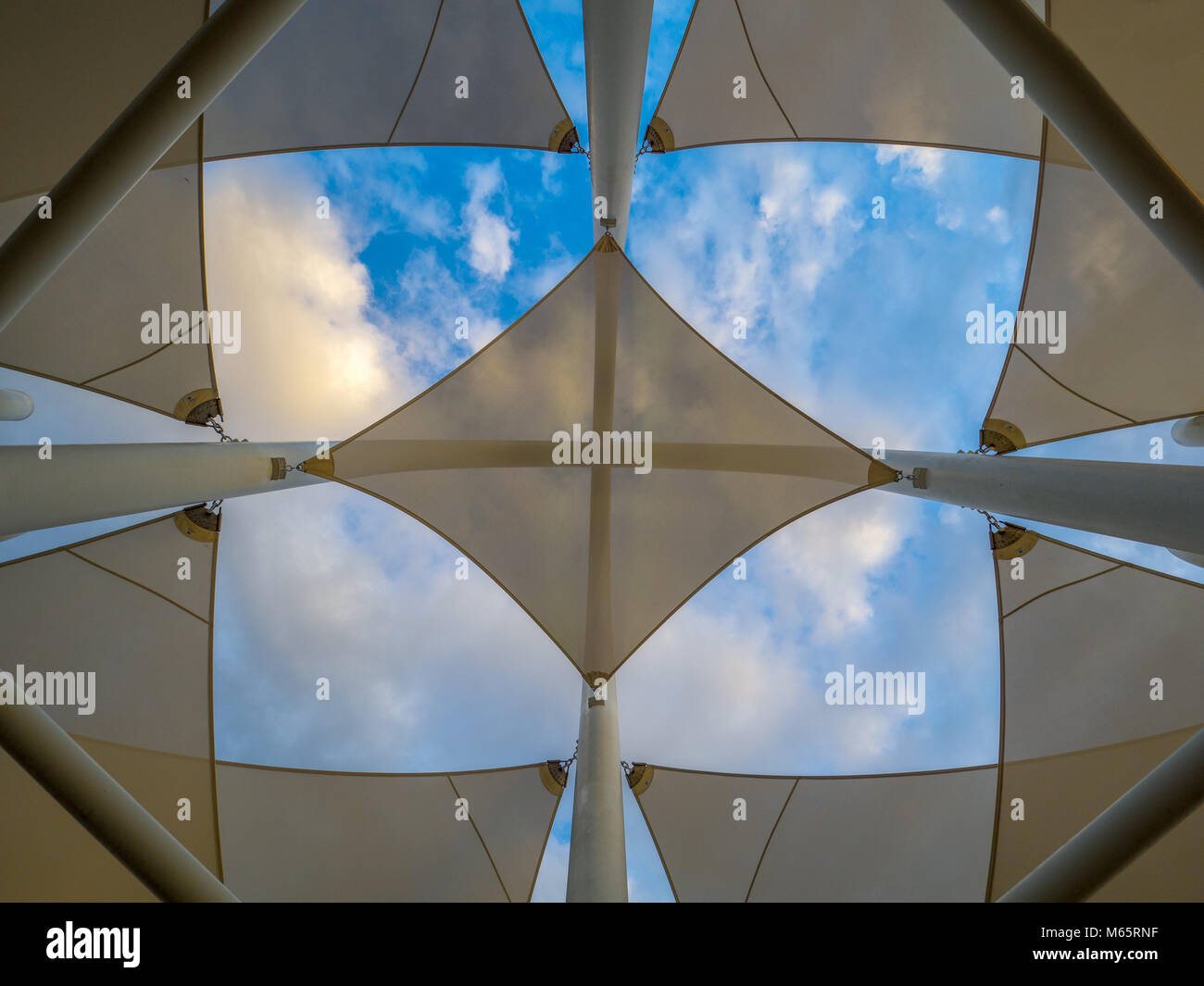 Geometric solar shade with blue sky and clouds Stock Photo - Alamy