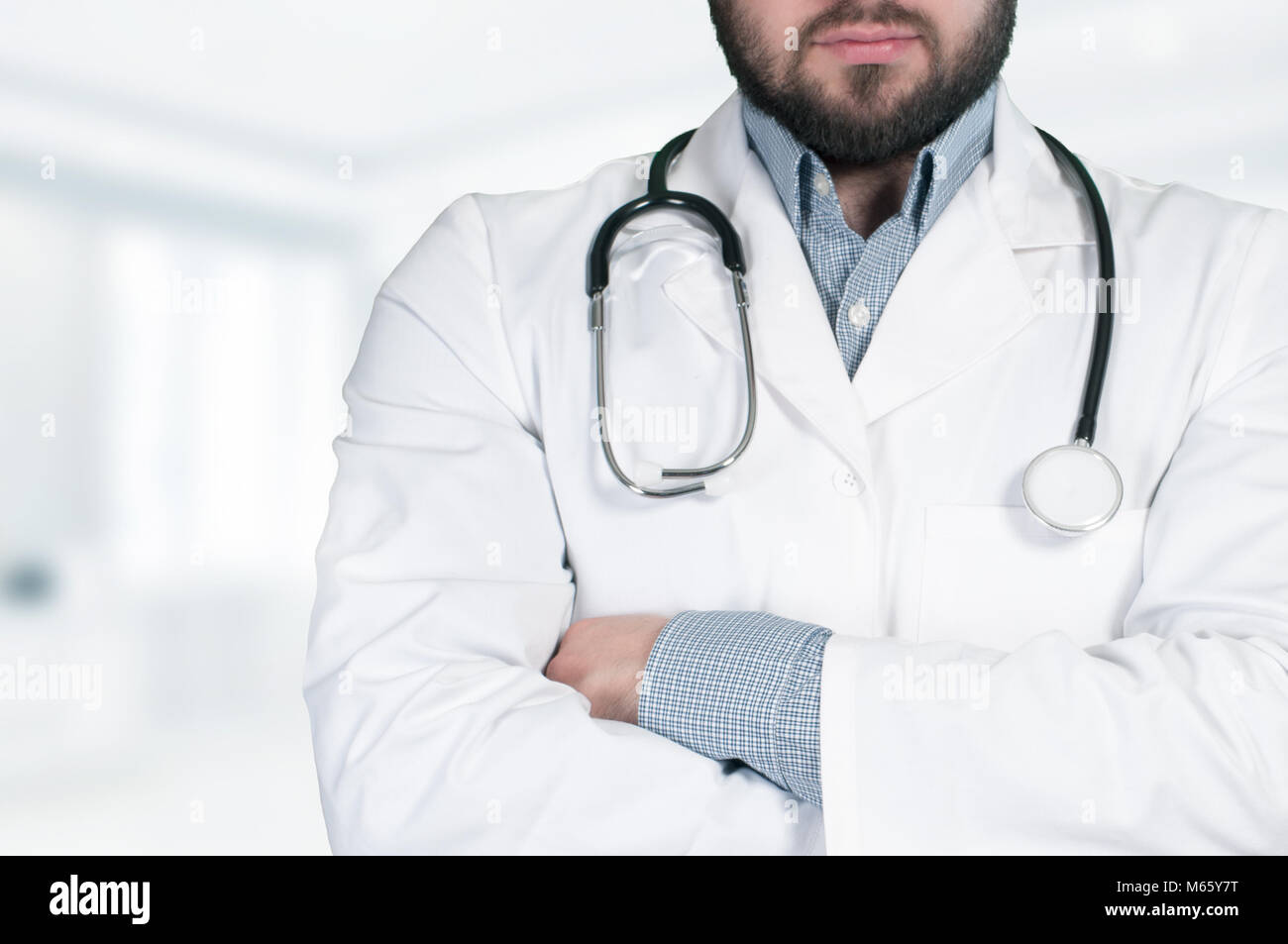 Medical doctor with stethoscope around his neck Stock Photo - Alamy