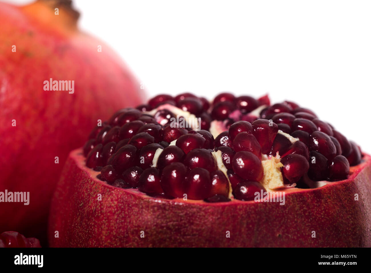 Close up view of tasty pommegranate fruit isolated on a white ...