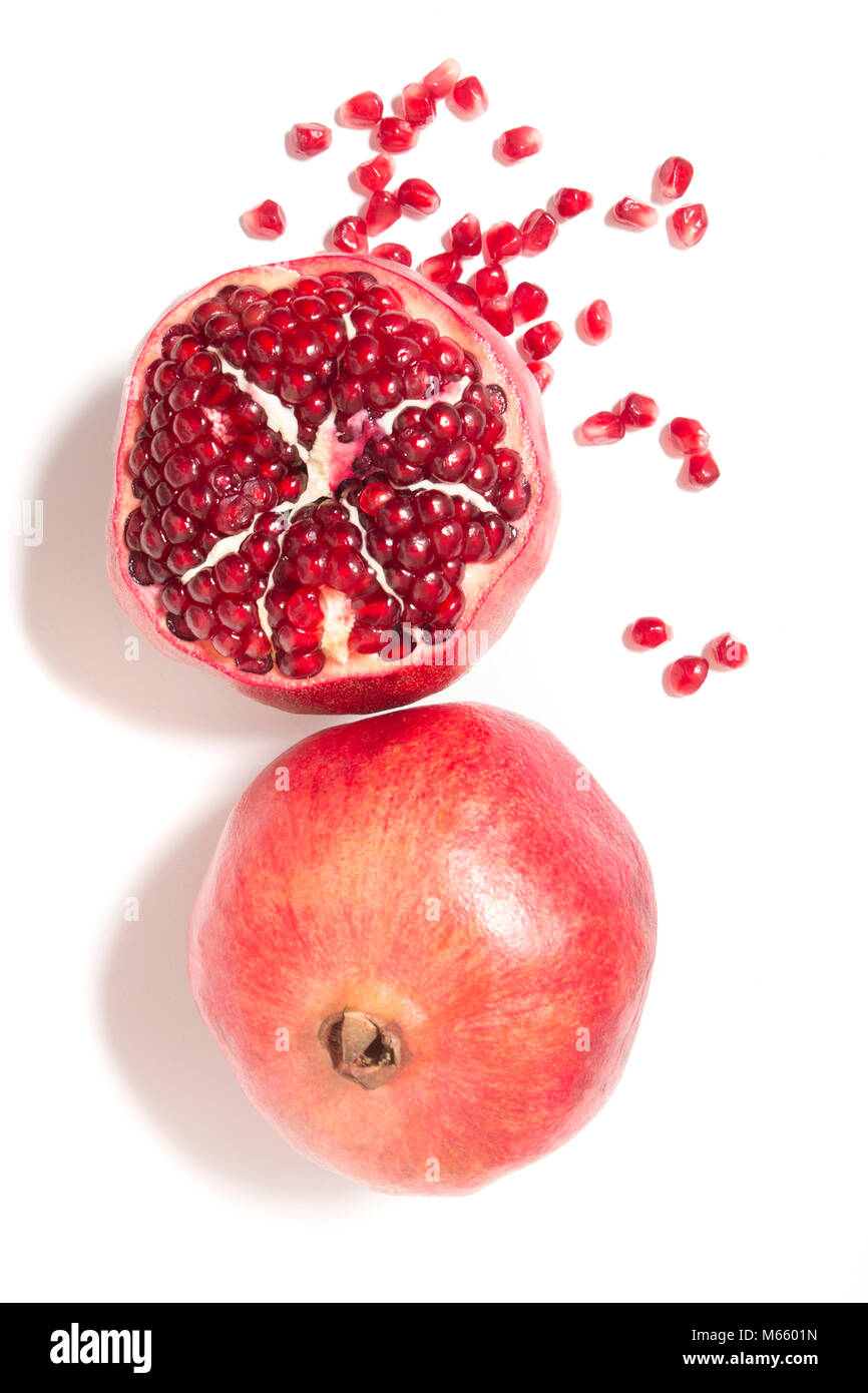 Close up view of tasty pommegranate fruit isolated on a white ...