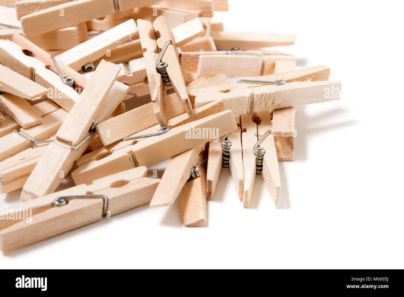 Pile of clothing pegs isolated on a white background Stock Photo - Alamy