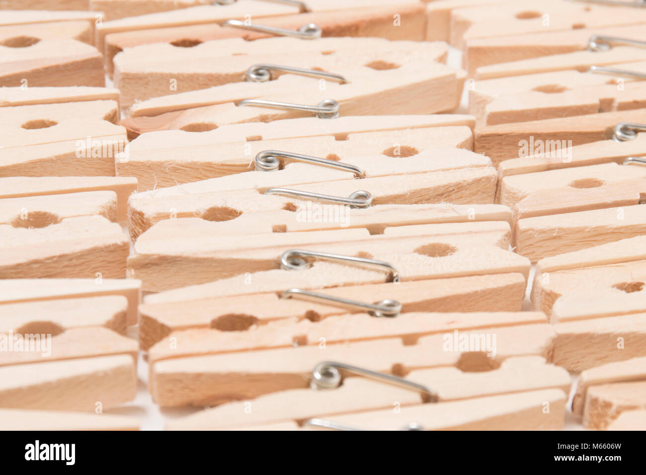 Aligned clothing pegs isolated on a white background Stock Photo - Alamy