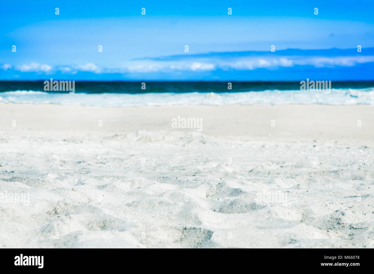Beautiful blue sky and sandy beach background Stock Photo - Alamy