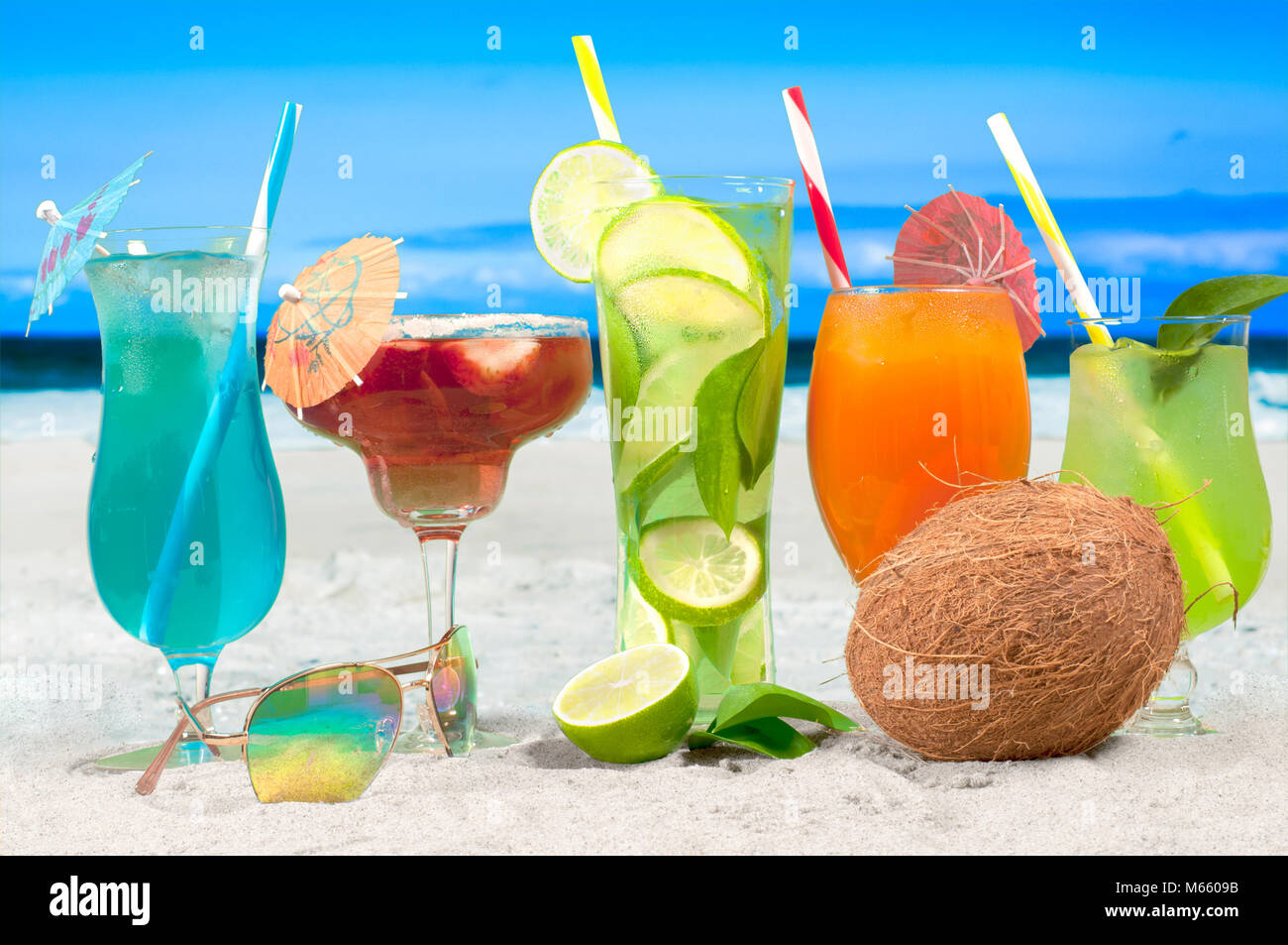 Tropical cocktails on sea background. Fresh mojito, juice and cocktails ...