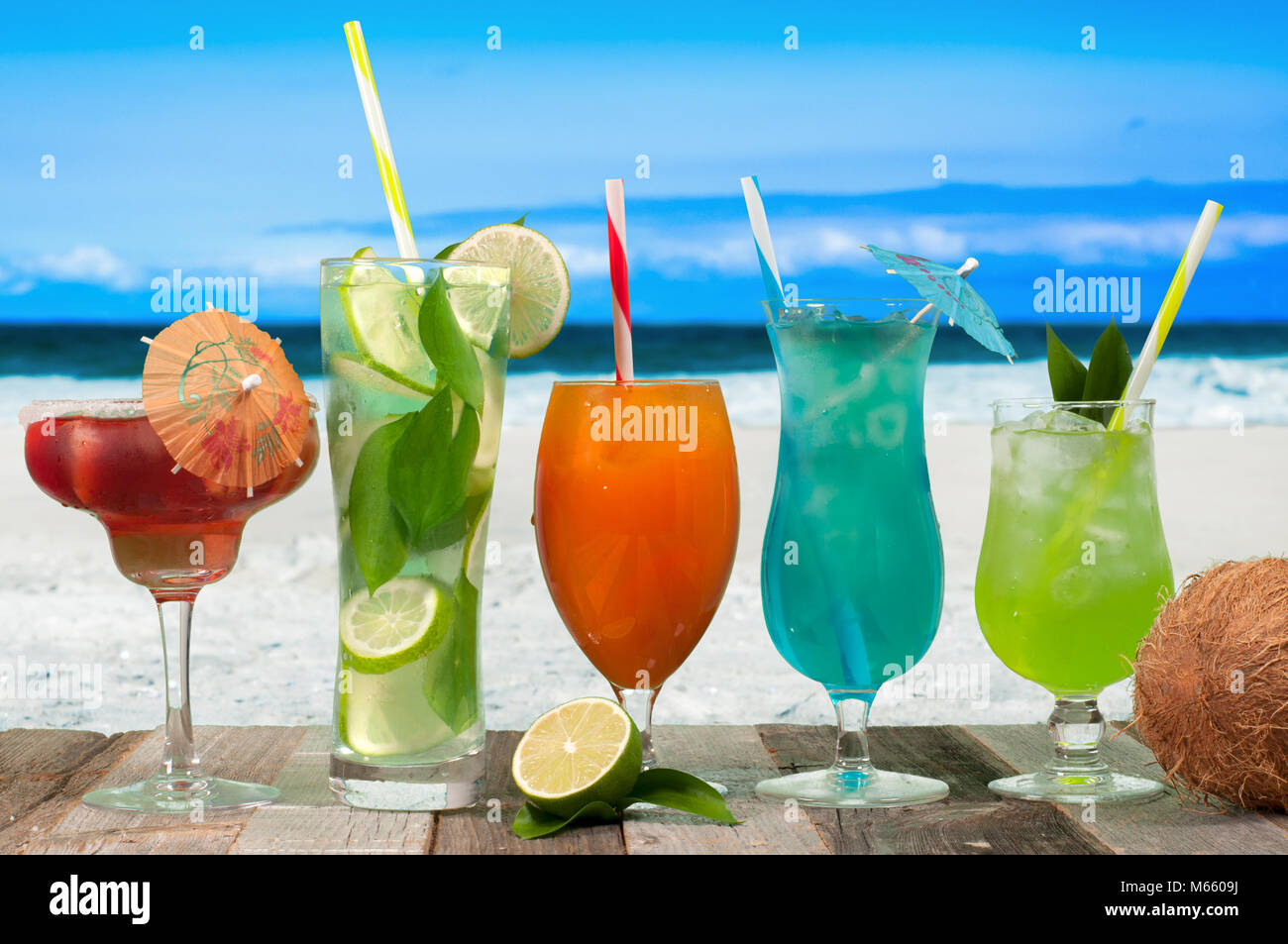 Tropical fresh drinks on sea background. Fresh mojito, juice and ...