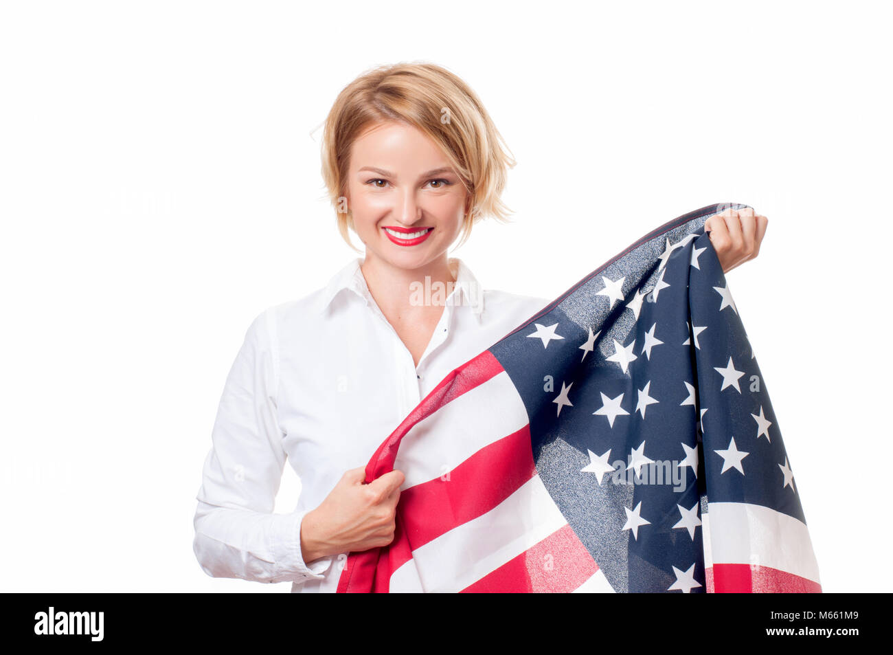 American flag. Smiling patriotic woman holding United States flag. USA ...