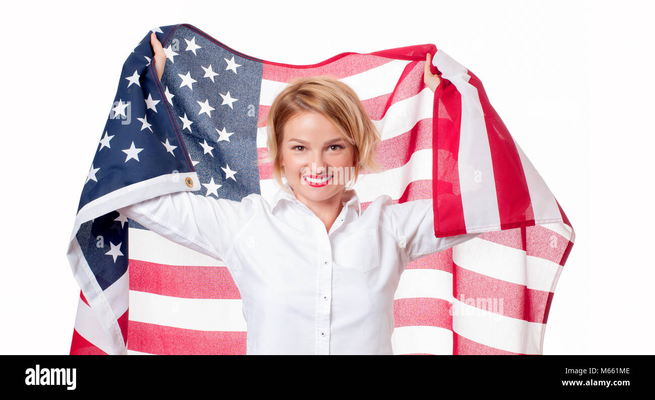 American flag. Smiling patriotic woman holding United States flag. USA ...