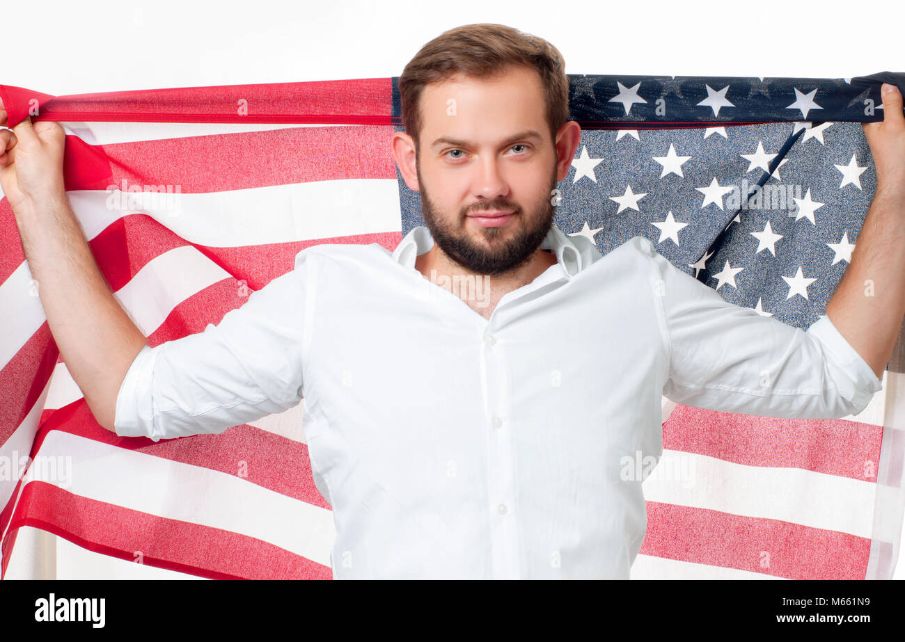 American flag. Smiling patriotic man holding United States flag. USA ...