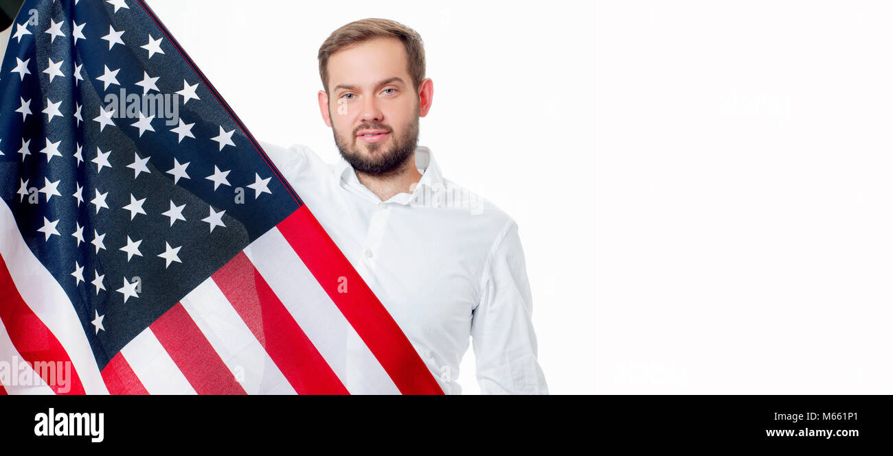 American flag. Smiling patriotic man holding United States flag. USA ...