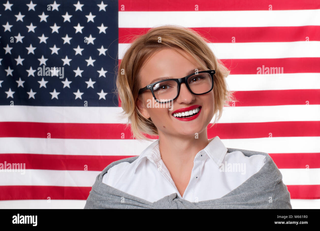 American flag. Smiling young man on United States flag background. USA ...