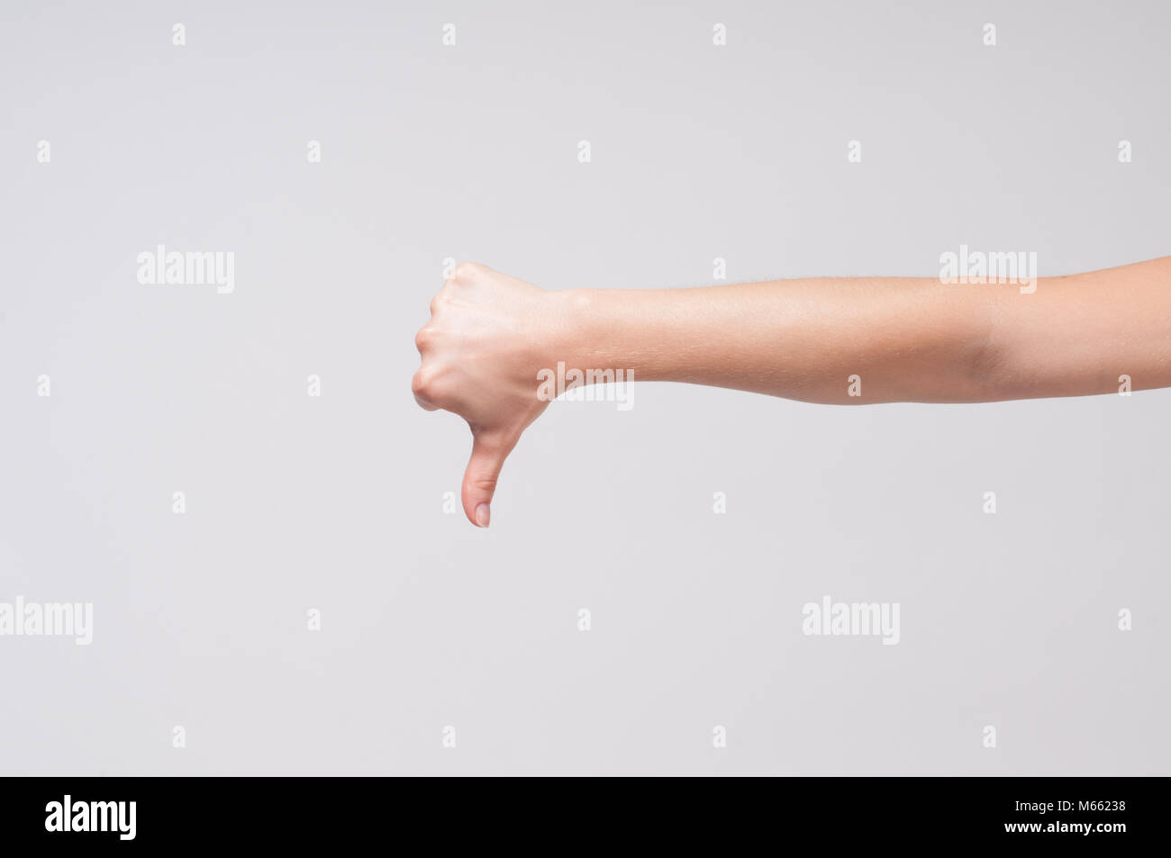 Human hand showing thumb down Stock Photo - Alamy