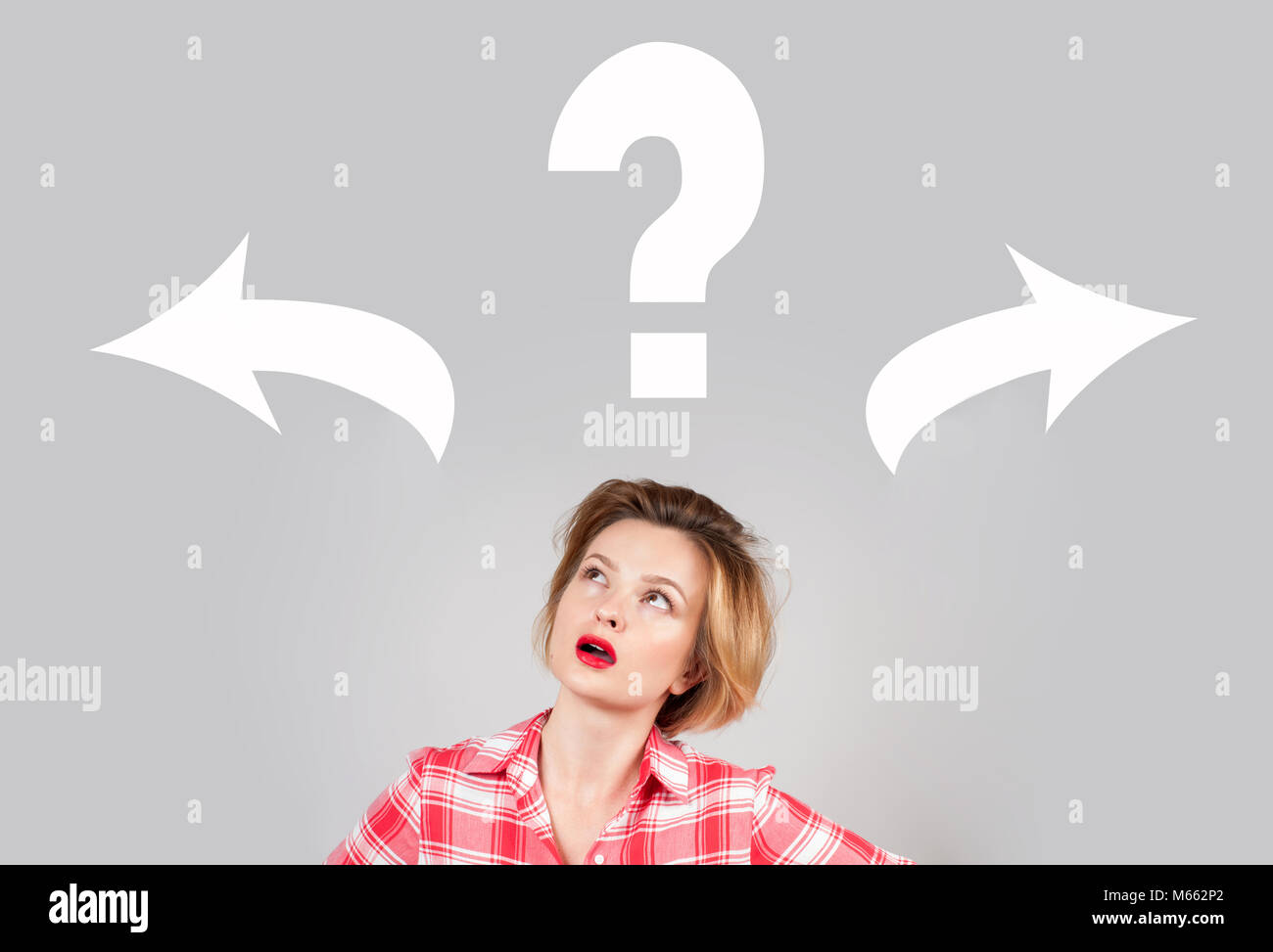 Young woman taking a decision with question mark and arrows above his ...