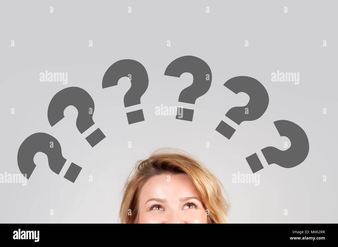 Many question marks. Thinking woman looking up with question marks ...