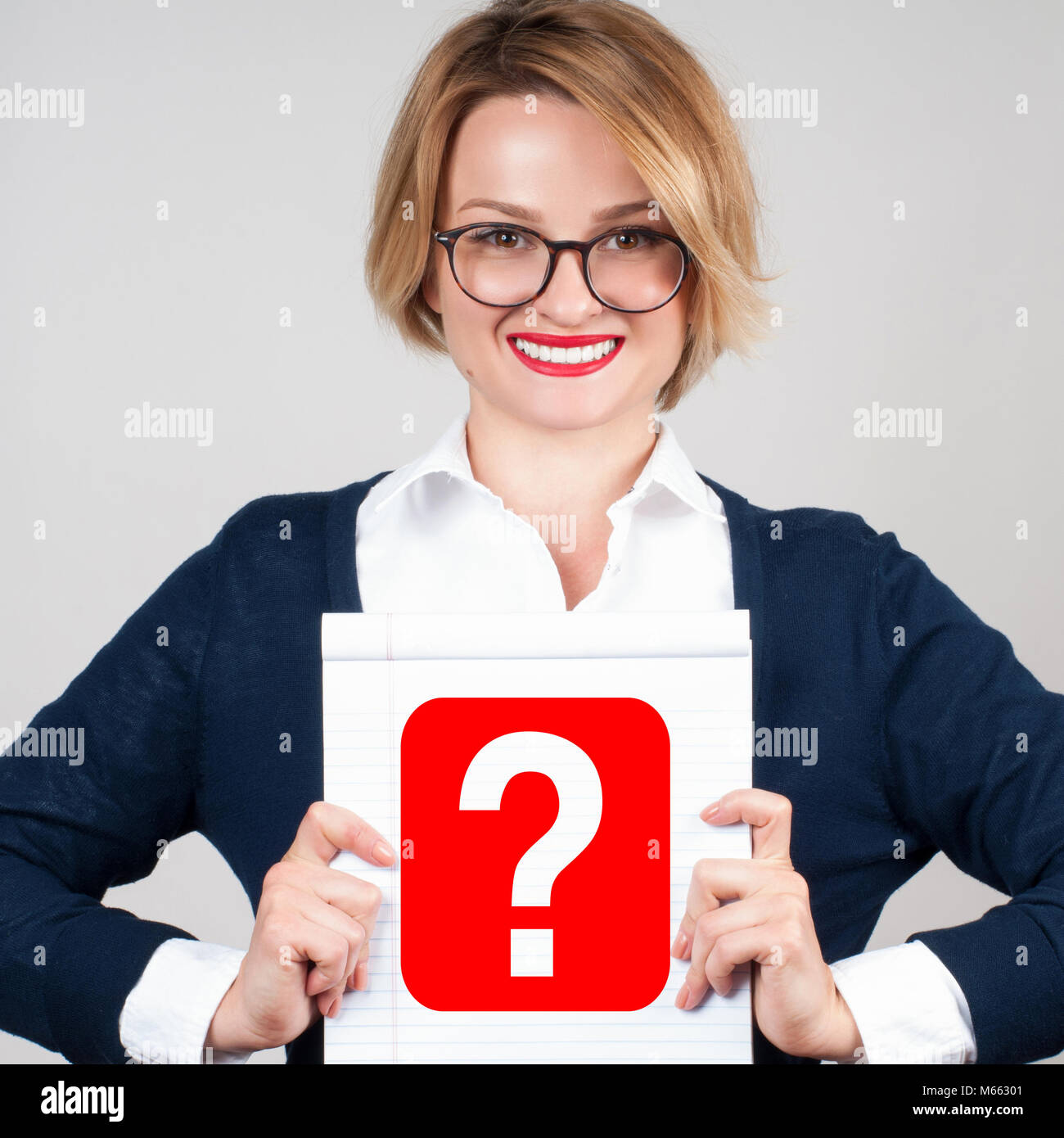 Beautiful business woman holding blank paper with question mark Stock ...