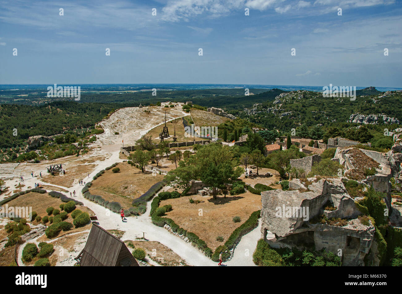 View of the Baux-de-Provence castle at the top of the hill, with the ...