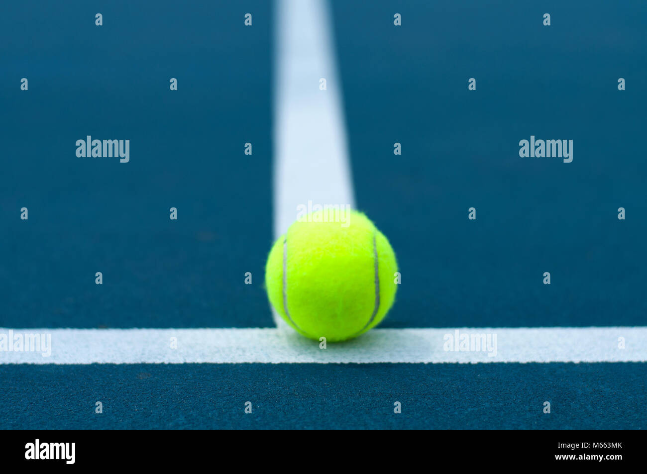 Close-up tennis ball on tennis court with white line Stock Photo - Alamy