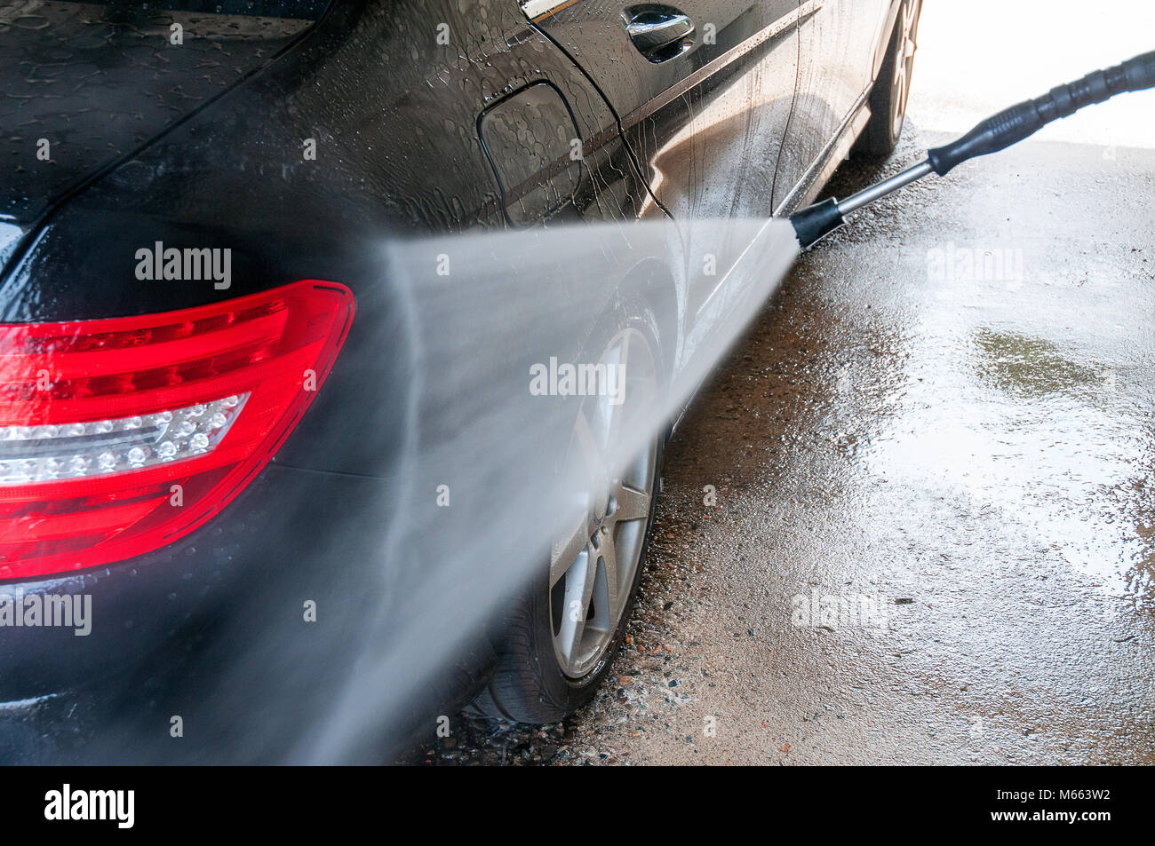 Car Washing. Closeup photo Modern Car Covered by Water Stock Photo - Alamy
