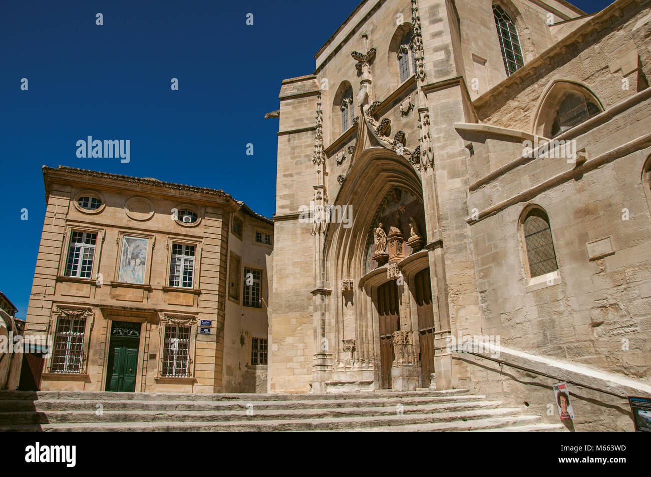 Building and front facade of church in the city center of Avignon ...