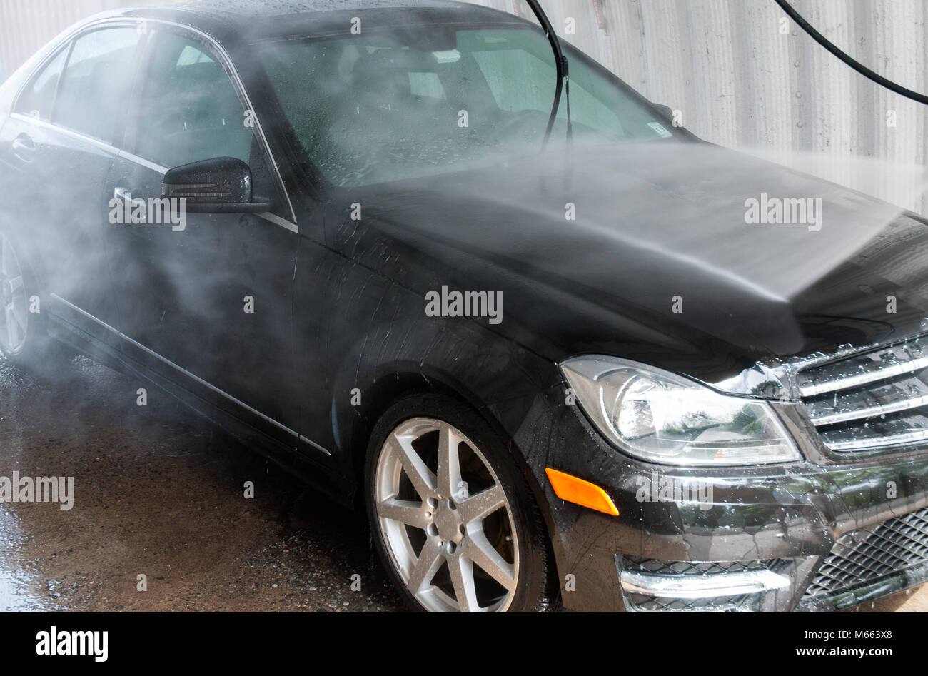 Car Washing. Closeup photo Modern Car Covered by Water Stock Photo - Alamy