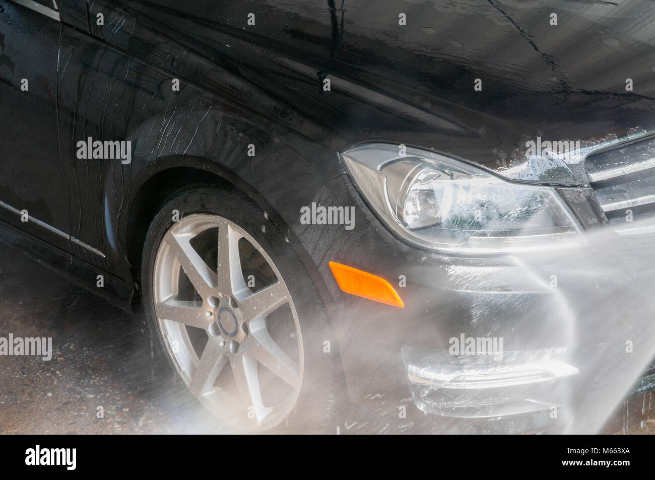 Car Washing. Modern Car Covered by Water. Closeup photo wheel and ...