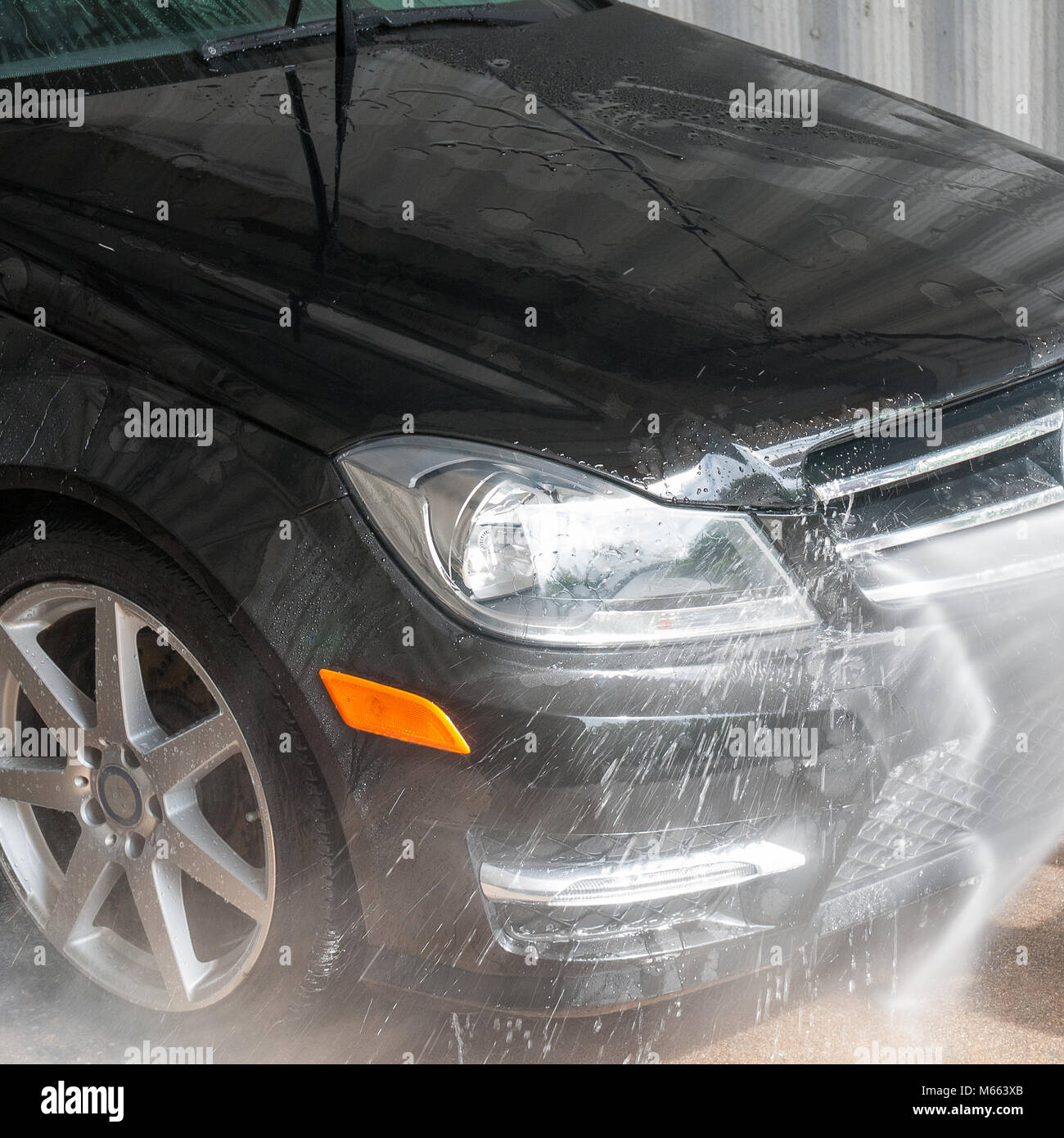 Car Washing. Closeup Modern Car Covered by Water Stock Photo - Alamy