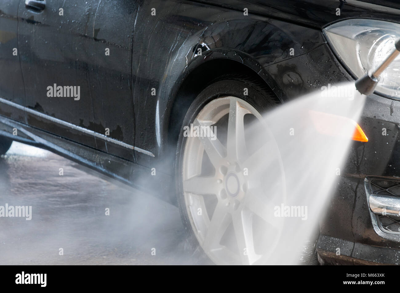 Car Washing. Closeup photo Modern Car Covered by Water Stock Photo - Alamy
