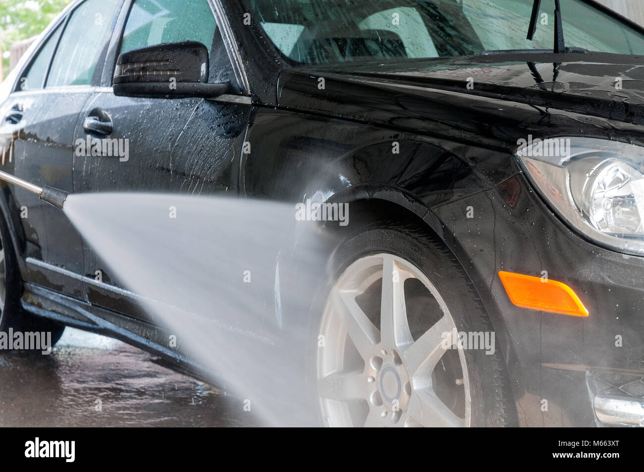 Car Washing. Closeup photo Modern Car Covered by Water Stock Photo - Alamy