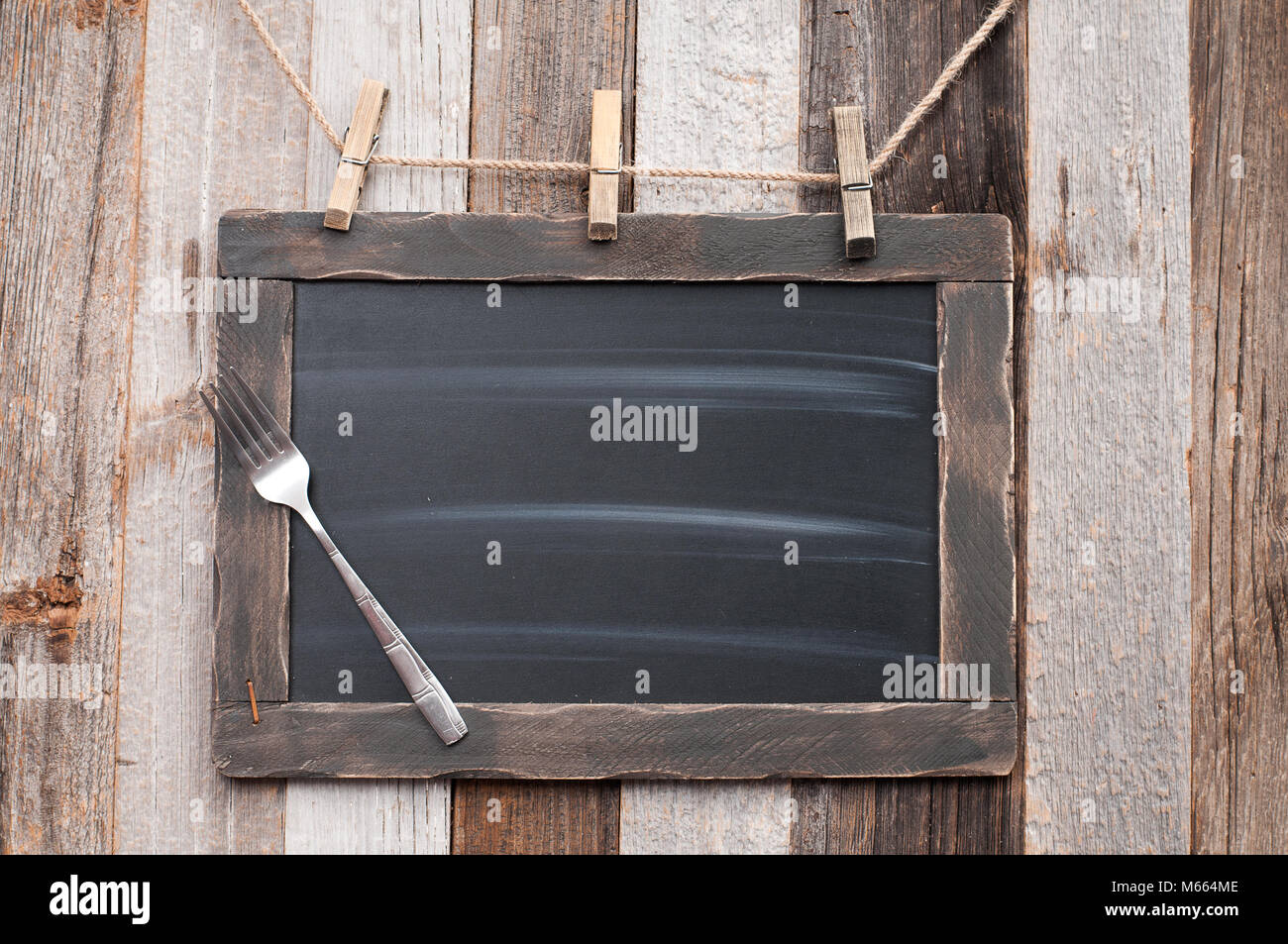 Menu blackboard with fork on wooden background. Vintage slate chalk ...