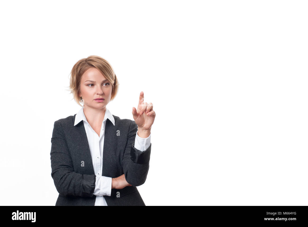 Businesswoman in front of visual touch screen. Business woman pushing ...