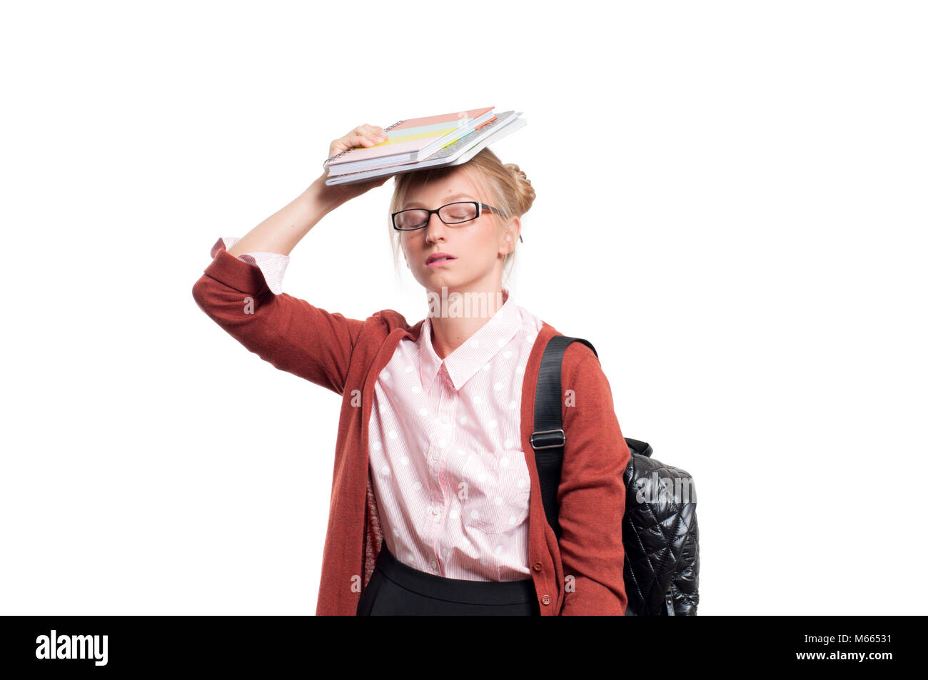 Annoyed young student girl holding books, standing isolated on white ...