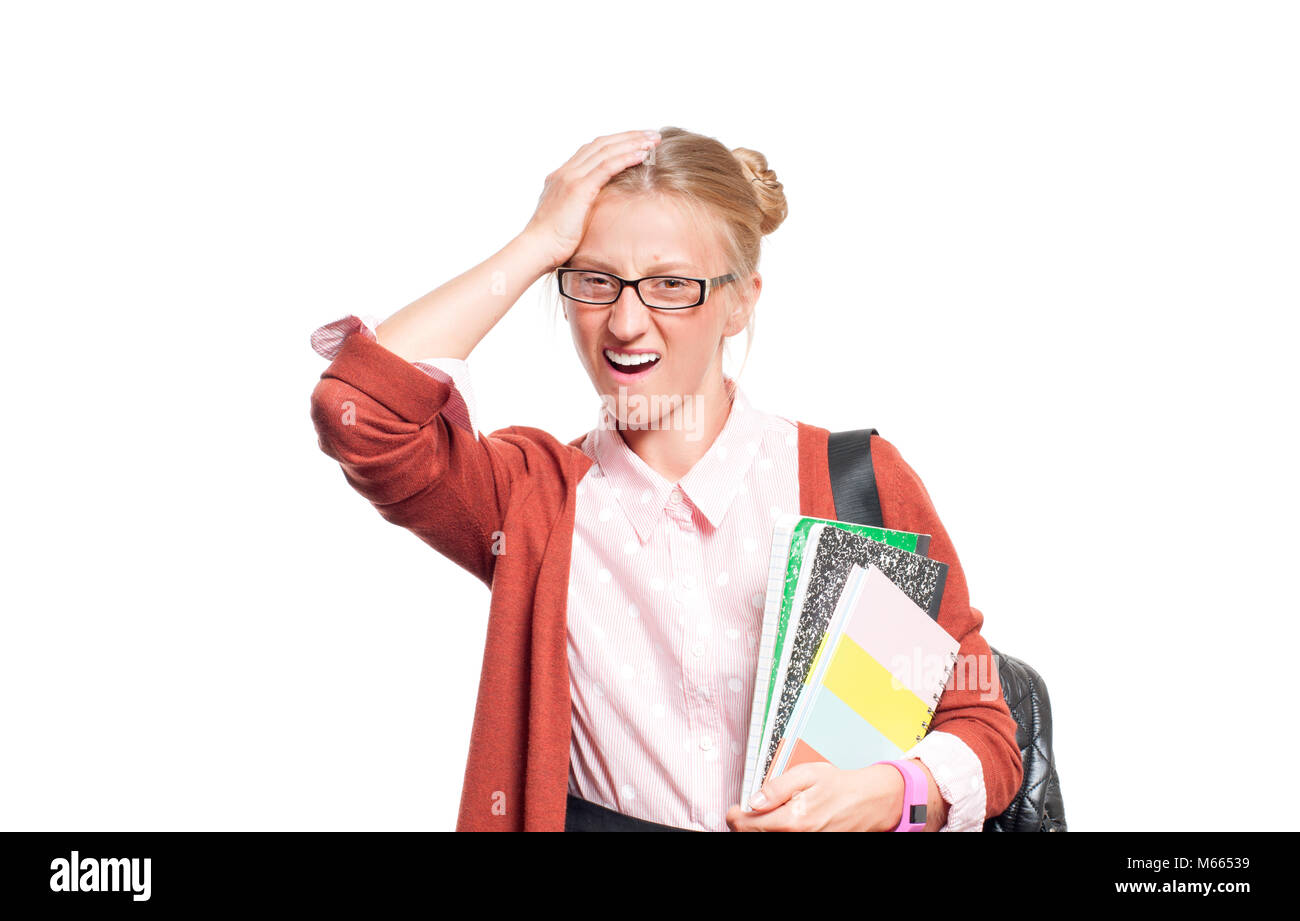 Annoyed young student girl holding books, standing isolated on white ...