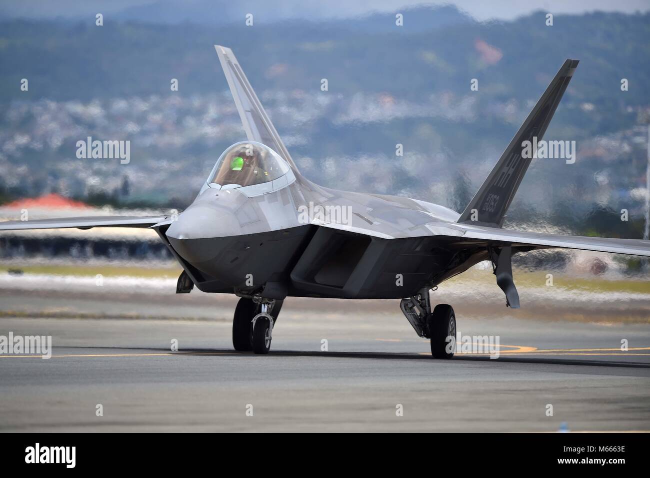 An F-22 Raptor taxis down the runway after landing at Joint Base Pearl ...