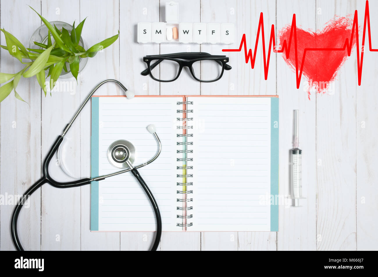 Workplace of doctor - stethoscope, medical items and pills on desk ...
